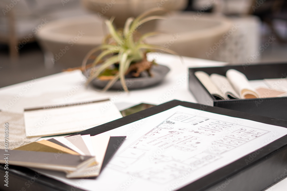 Interior designer's working table, an architectural plan of the house ...