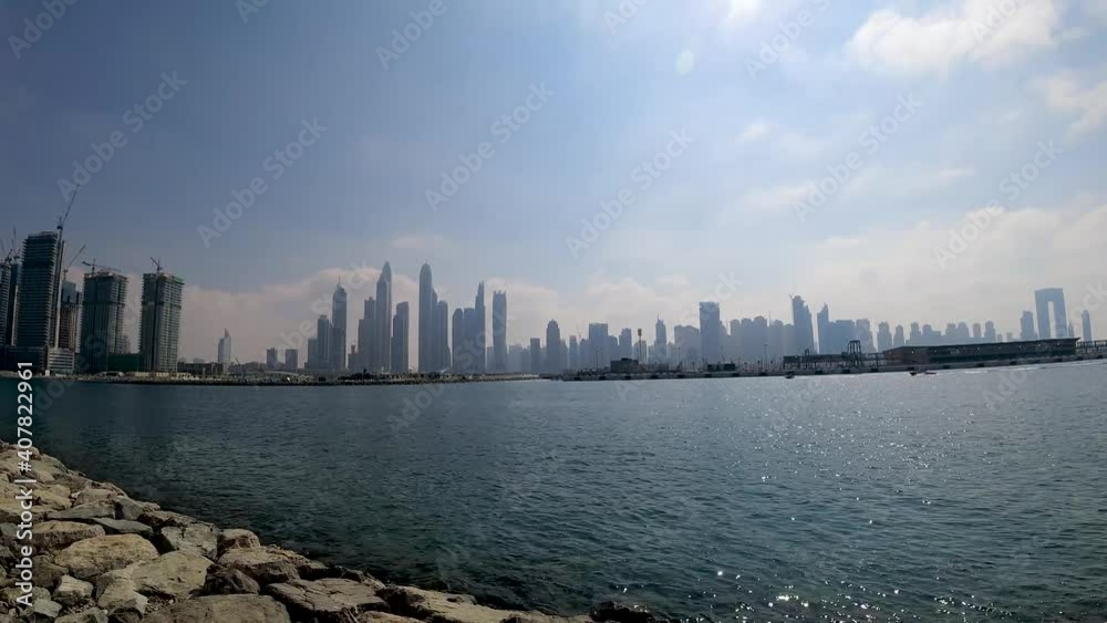 Dubai, UAE - CIRCA 2021: Time lapse of Dubai Marina skyline . Boats and ...