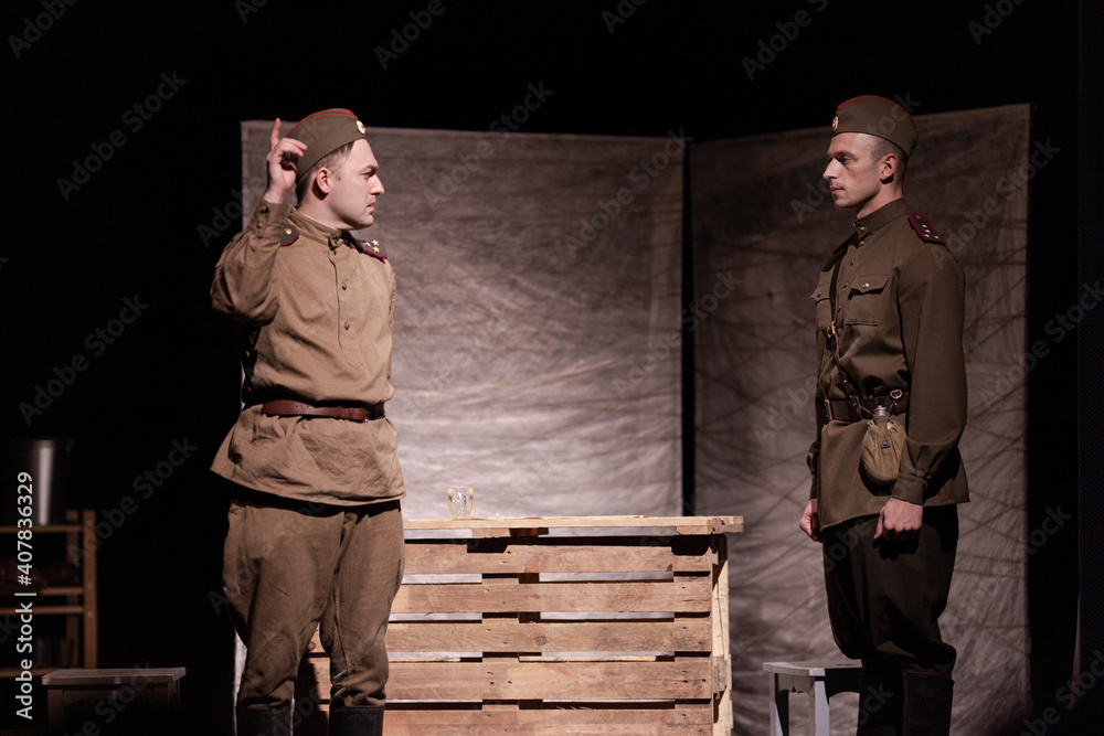 Actors in military uniforms of the Soviet army of World War II play a ...
