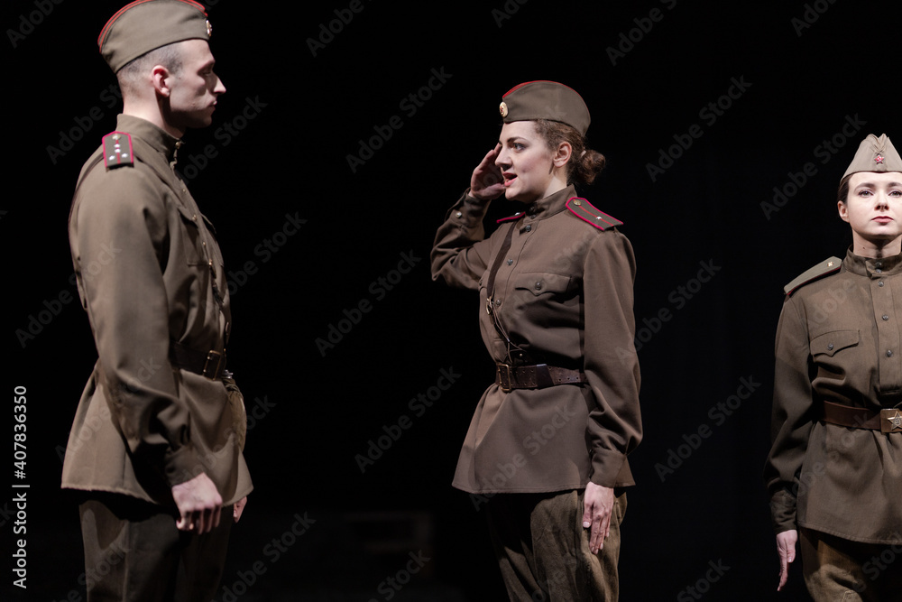 Actors in military uniforms of the Soviet army of World War II play a ...