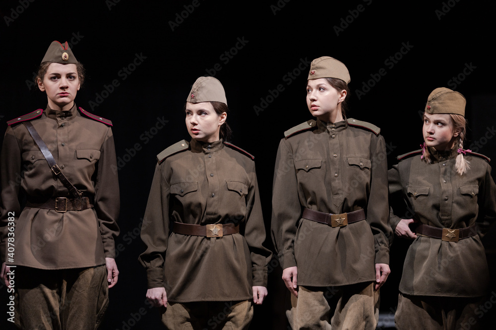 Actors in military uniforms of the Soviet army of World War II play a ...