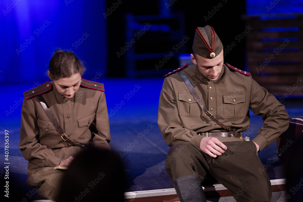 Actors in military uniforms of the Soviet army of World War II play a ...