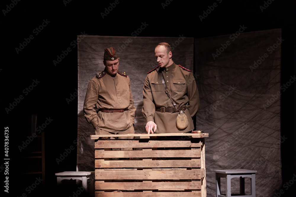 Actors in military uniforms of the Soviet army of World War II play a ...
