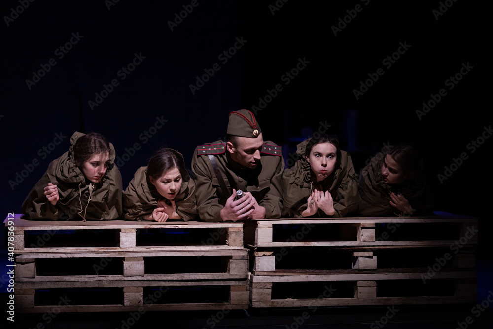 Actors in military uniforms of the Soviet army of World War II play a ...