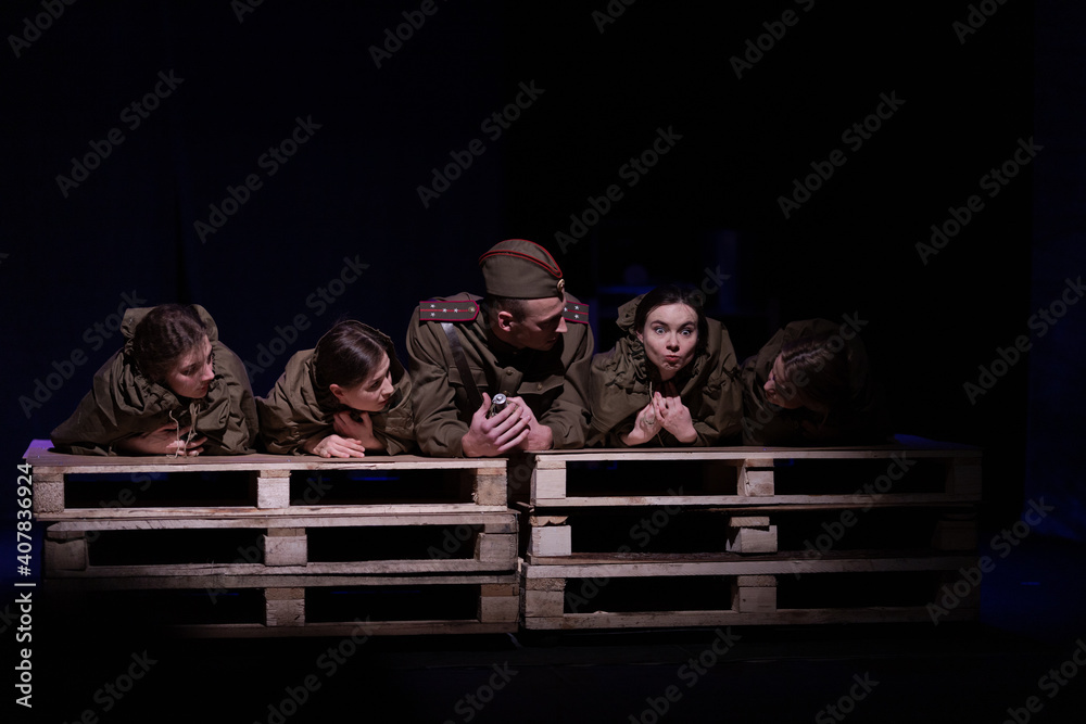 Actors in military uniforms of the Soviet army of World War II play a ...