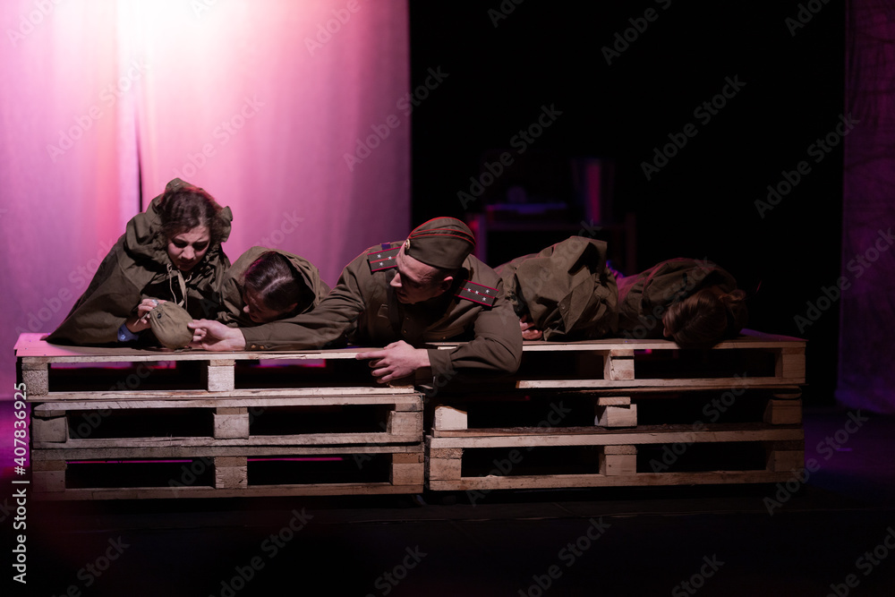 Actors in military uniforms of the Soviet army of World War II play a ...