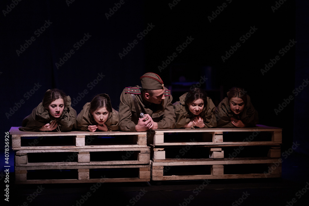 Actors in military uniforms of the Soviet army of World War II play a ...