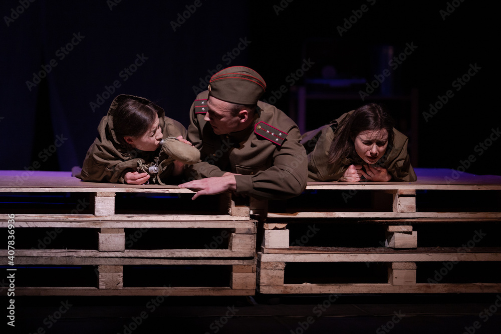 Actors in military uniforms of the Soviet army of World War II play a ...