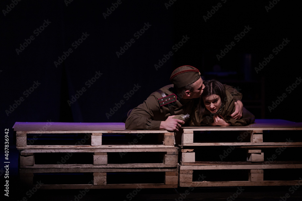 Actors in military uniforms of the Soviet army of World War II play a ...