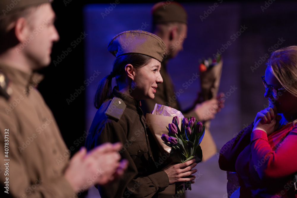 Actors in military uniforms of the Soviet army of World War II play a ...