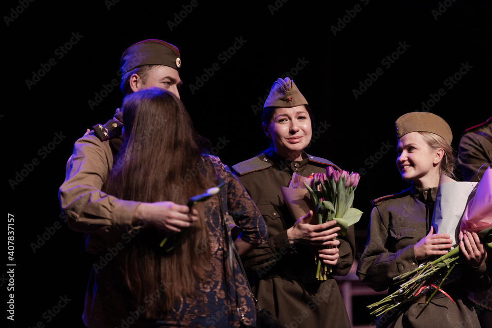 Actors in military uniforms of the Soviet army of World War II play a ...