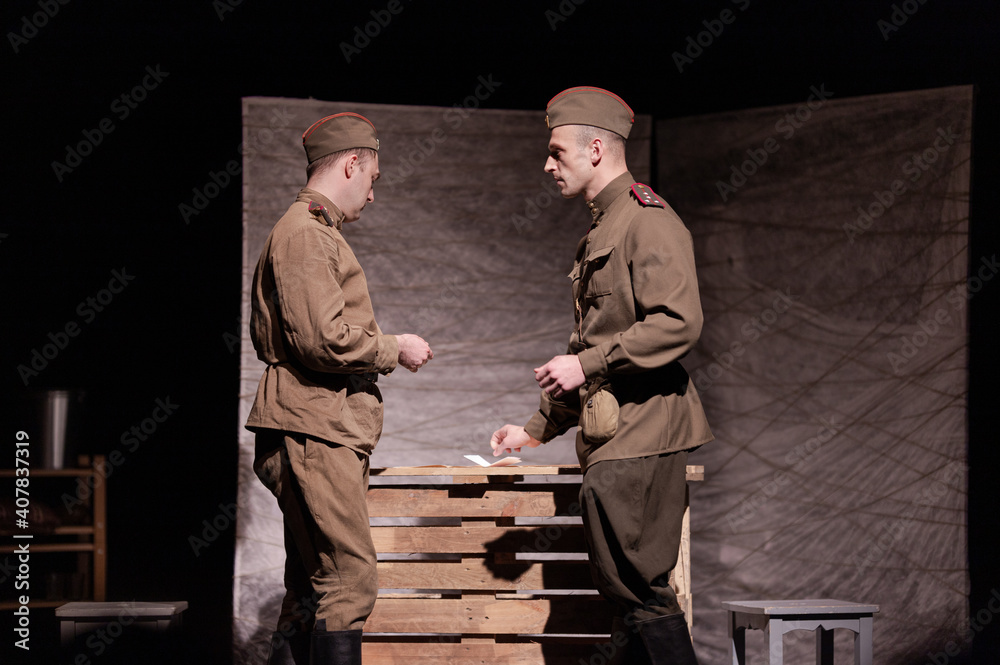 Actors in military uniforms of the Soviet army of World War II play a ...