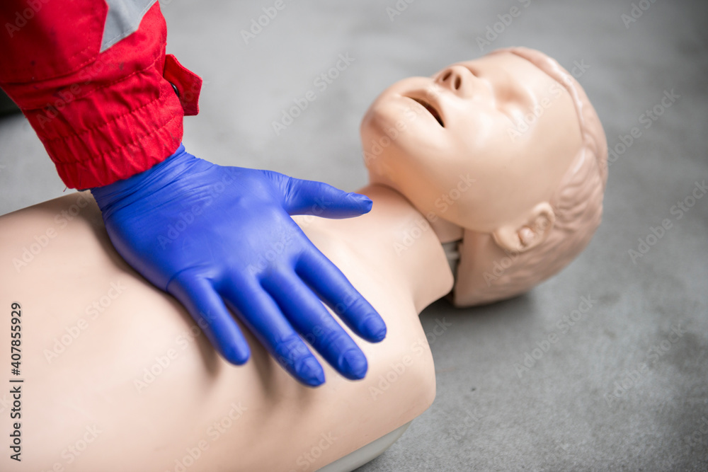 Paramedic practicing bls and cpr on a child mannequin. Stock Photo ...