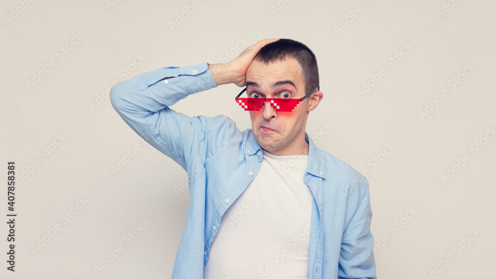 Puzzled man film fan with pixel glasses, guy is confused, portrait ...