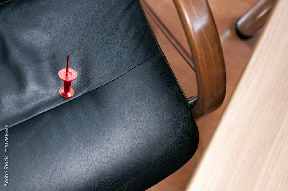 Large red push pin on chair, workplace. April Fools' Day, April 1 ...
