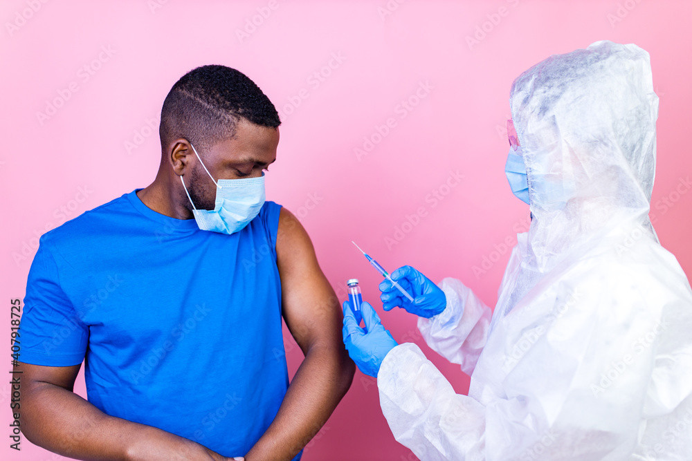 Corona Virus SARS-CoV-2 vaccination concept : man in pink studio wall ...