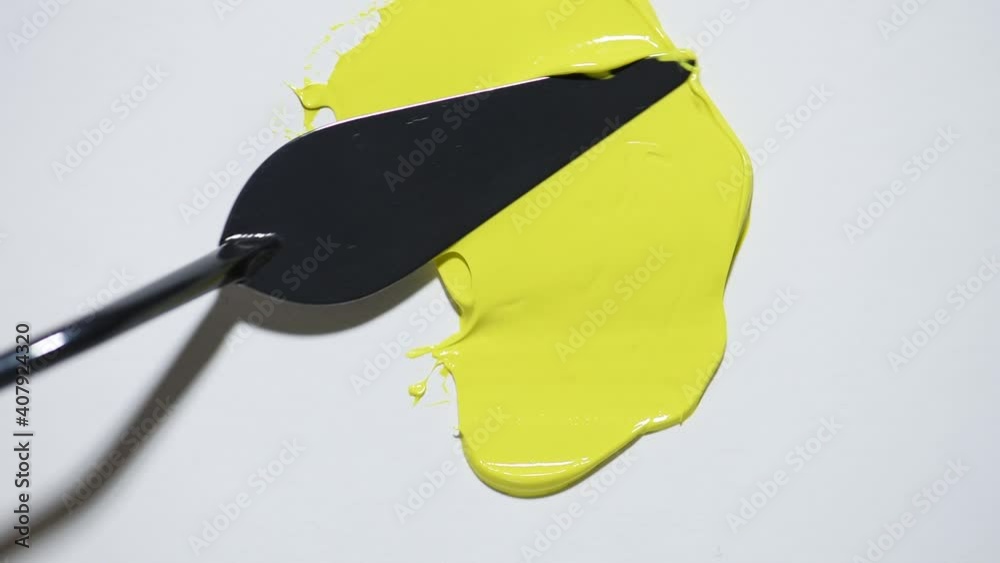 Color of the 2021 year illuminating. Yellow oil paint applying paint ...