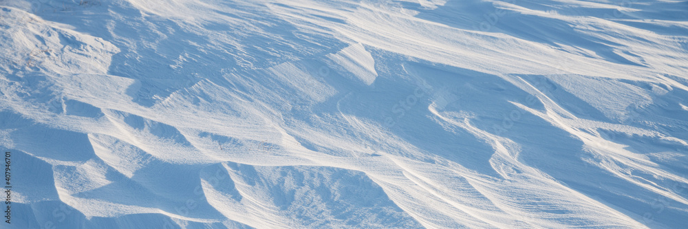 Snow texture. Wind sculpted patterns on snow surface. Wind in the ...