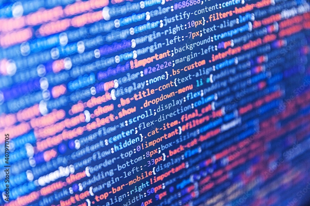 Simple website HTML code with colorful tags in browser view on dark background. Database bits ...