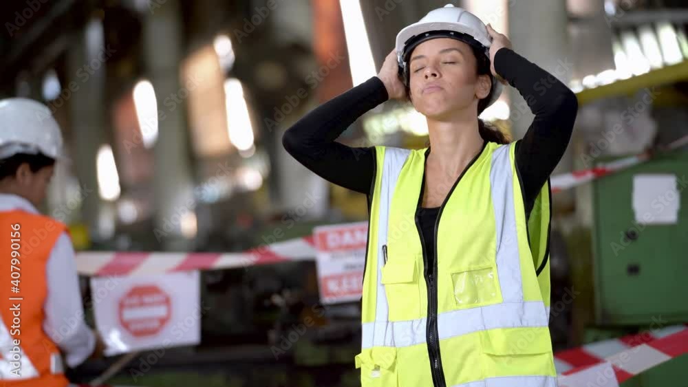 factory worker woman feeling bad and upset and standing in front of ...