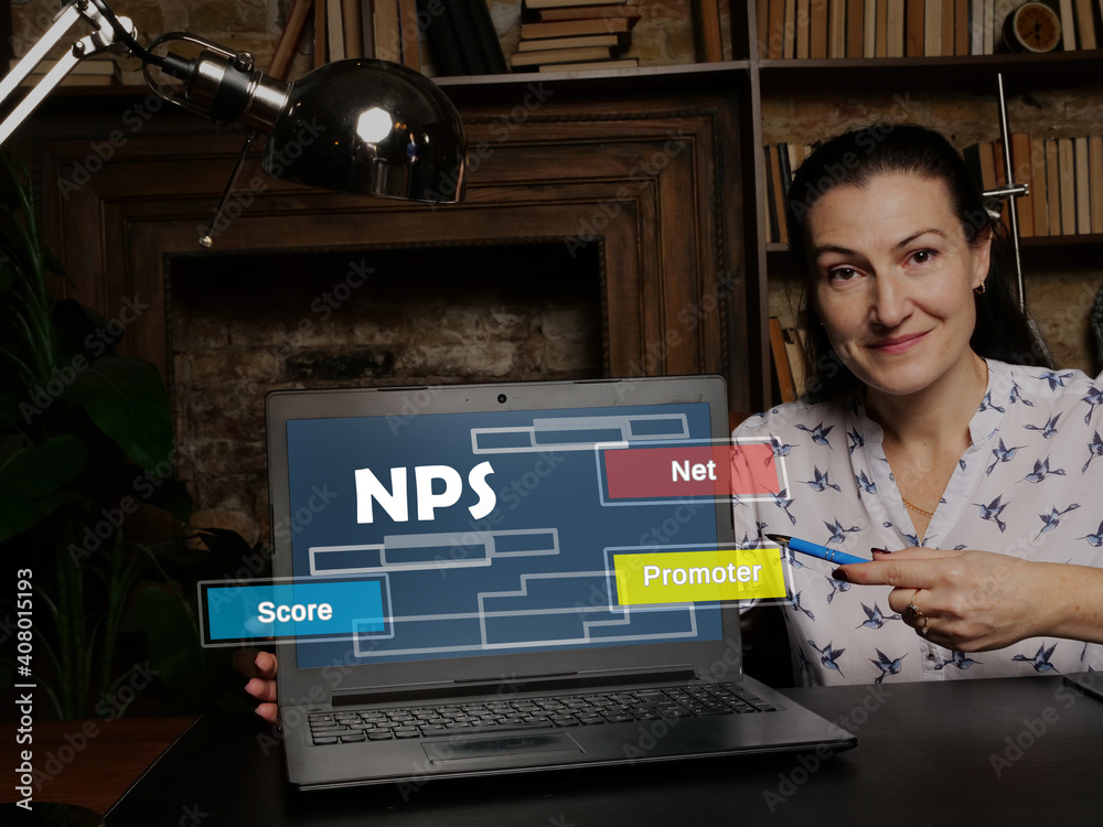 Woman using laptop computer with NPS Net Promoter Score icon on screen ...