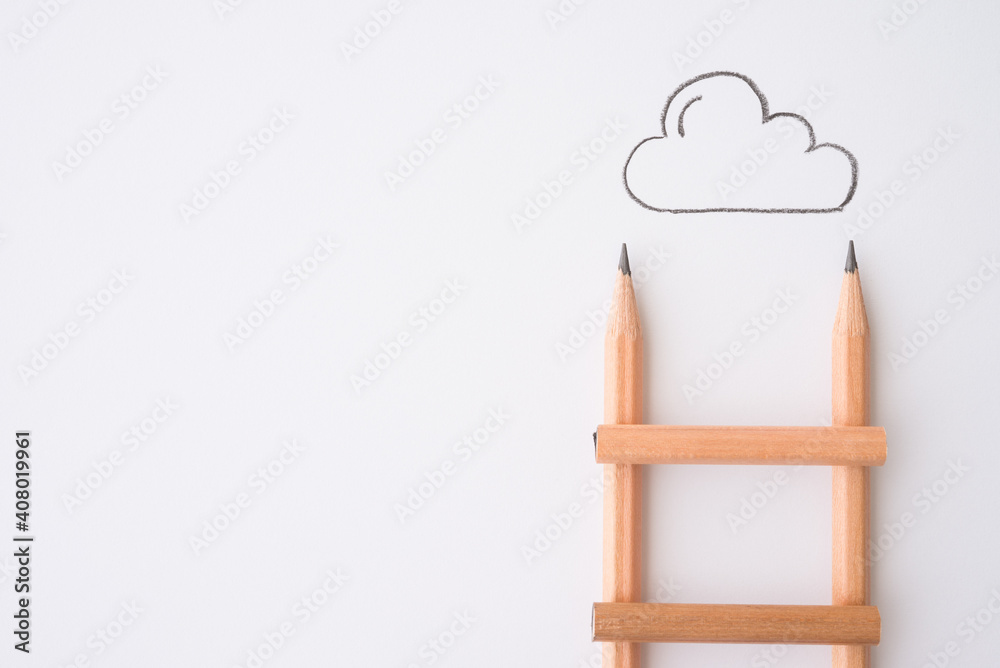 Flat lay of pencil ladder and outline cloud on white paper background ...