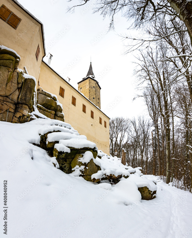 Medieval castle Rostejn in winter during snowfalling. Castle is placed ...