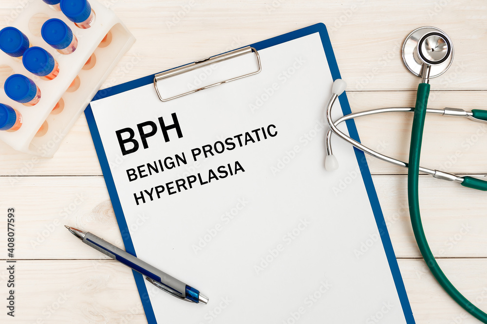 Paper with BPH - Benign Prostatic Hyperplasia on a table, stethoscope ...