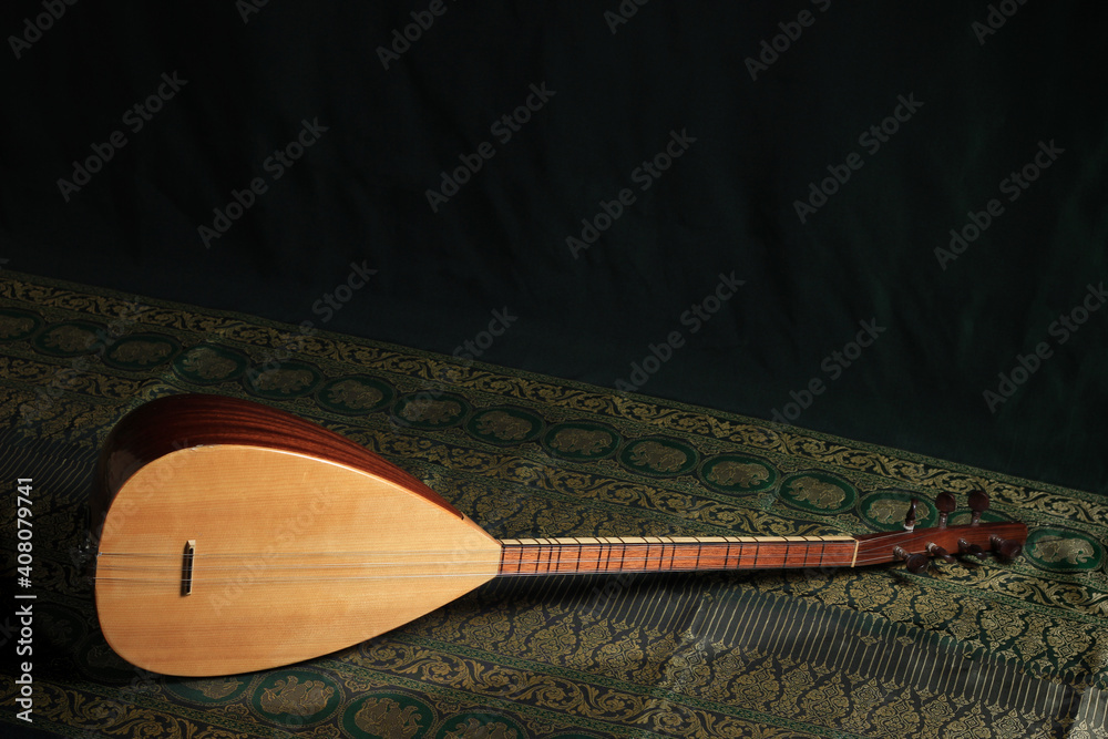 traditional Turkish national musical instrument baglama saz on a dark ...