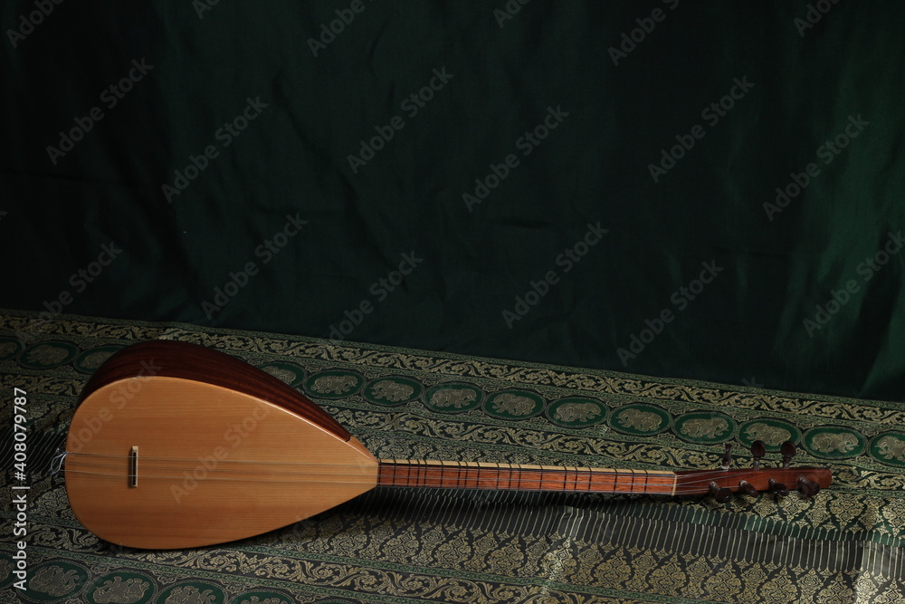traditional Turkish national musical instrument baglama saz on a dark ...