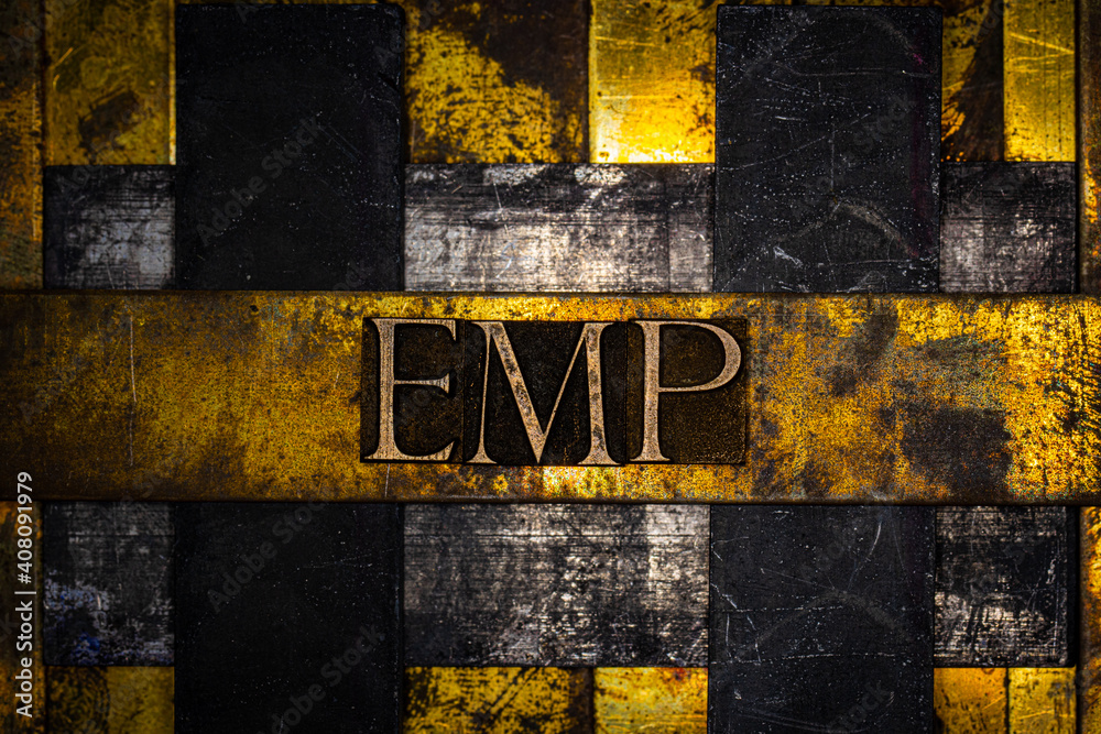 EMP text on vintage textured grunge copper and gold background Stock ...