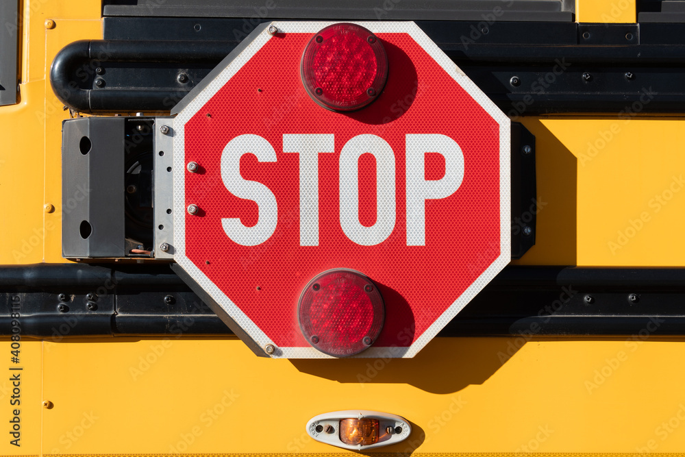 Stop sign on the side of a school bus Stock Photo | Adobe Stock