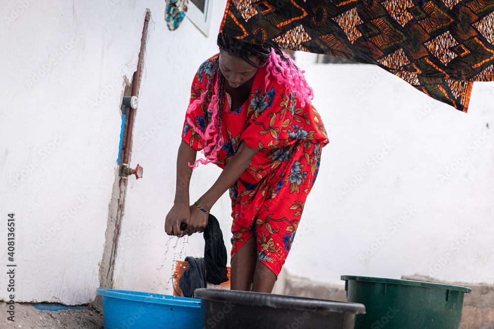 African nice woman hand washing laundry outdoors Stock Photo | Adobe Stock