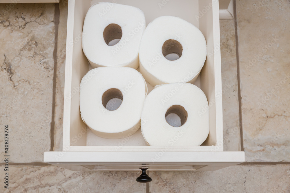 Toilet paper organized in a drawer Stock Photo | Adobe Stock