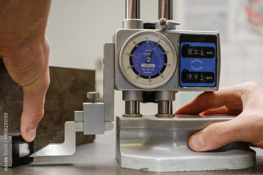Person At Metalworking With A Height Measuring Device - Close-up Stock ...