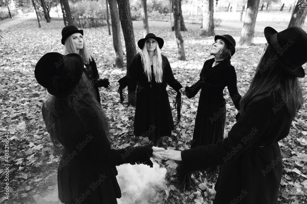 Coven of witches, modern witches gathered and do a ritual in the Park ...
