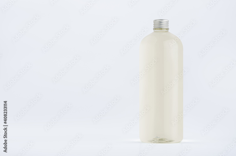 Transparent plastic tall bottle with pale fresh drink or cosmetic ...