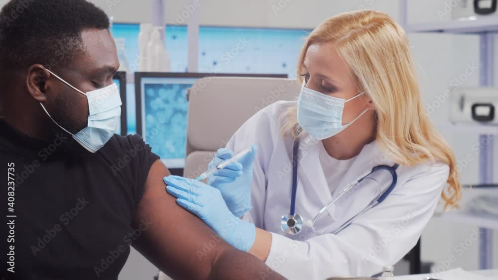 Doctor makes a coronavirus vaccine using a syringe and hypodermic ...