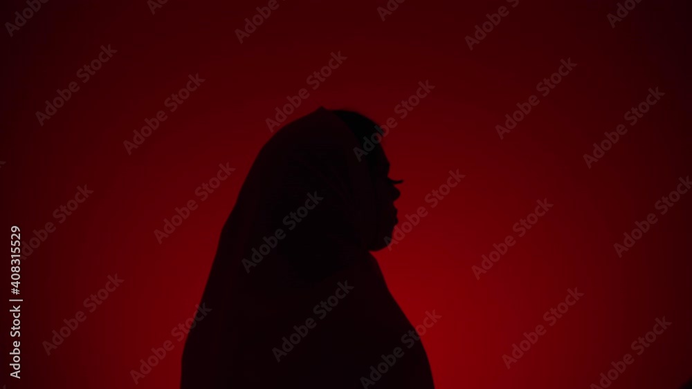 Brave shadow woman warrior with a japanese katana sword exercises in ...