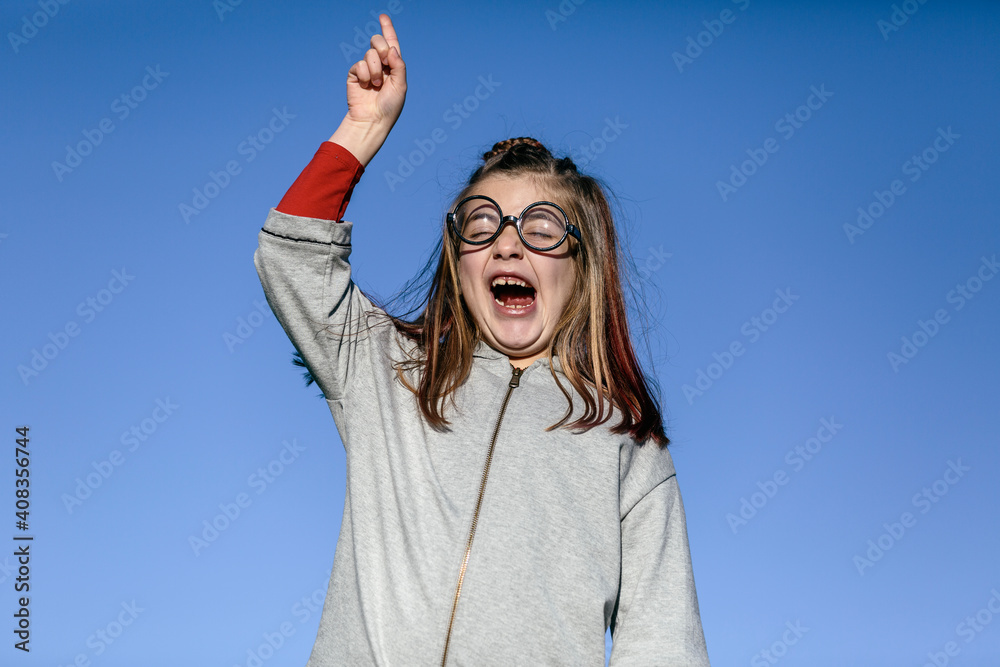 Caucasian girl with round nerd glasses, raising a finger, with ugly and ...