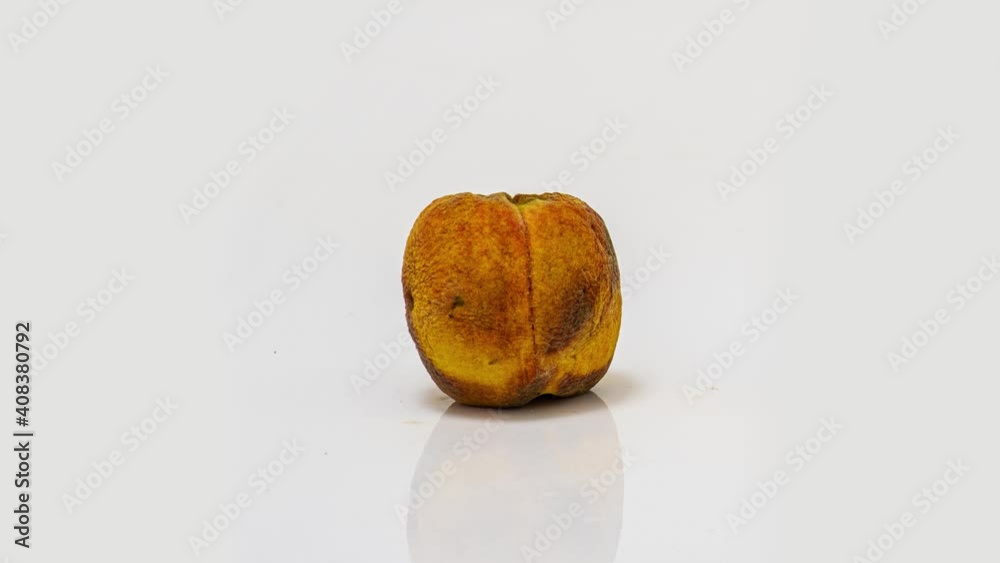 Time lapse of peach rotting on a white background, the process of ...