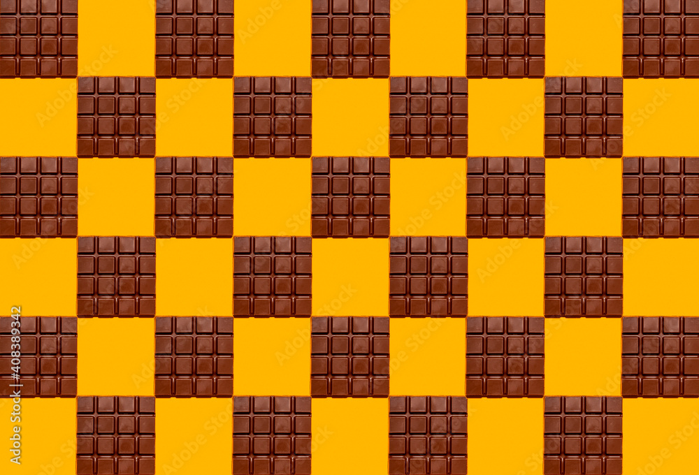 Pattern of chocolate bars against yellow background Stock Photo | Adobe ...