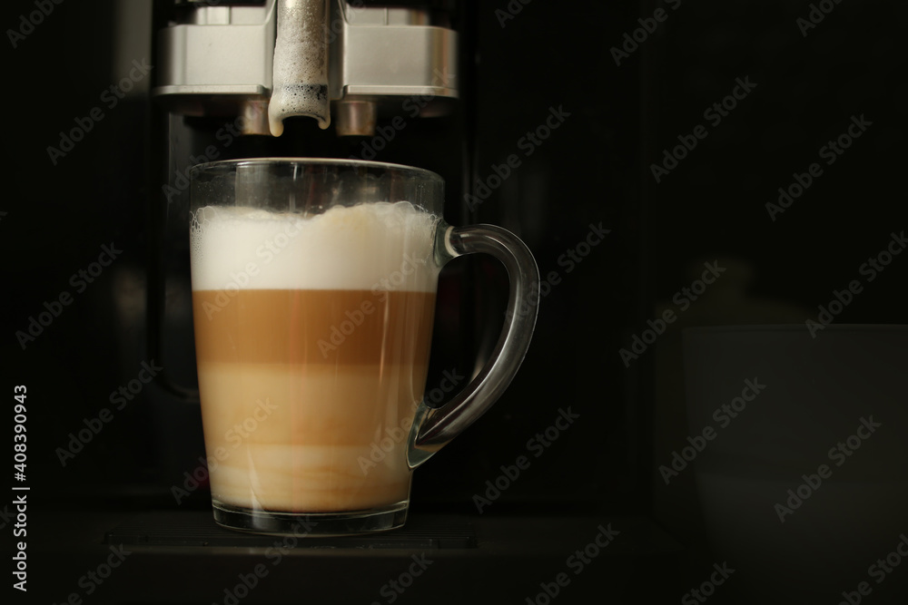 The finished coffee has three layers of white, beige and brown ...