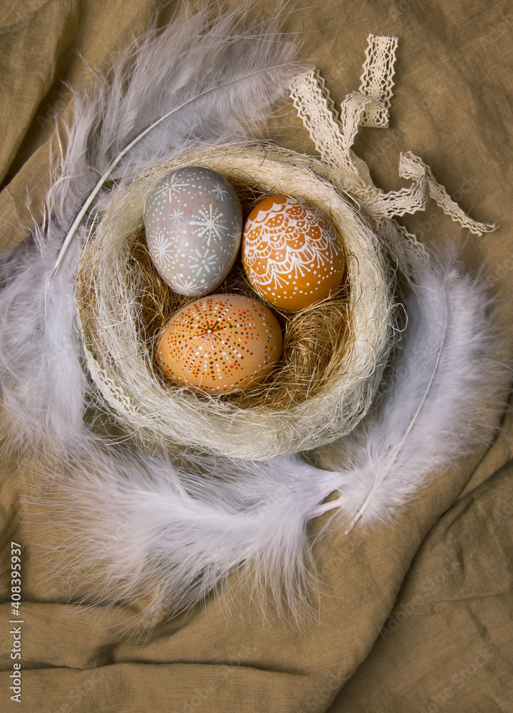 Ostara symbols. Colorized eggs in a nest. Stock Photo | Adobe Stock