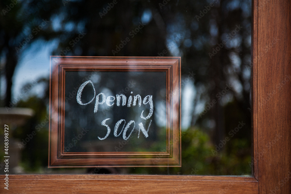 Opening Soon sign on glass shop door Stock Photo | Adobe Stock