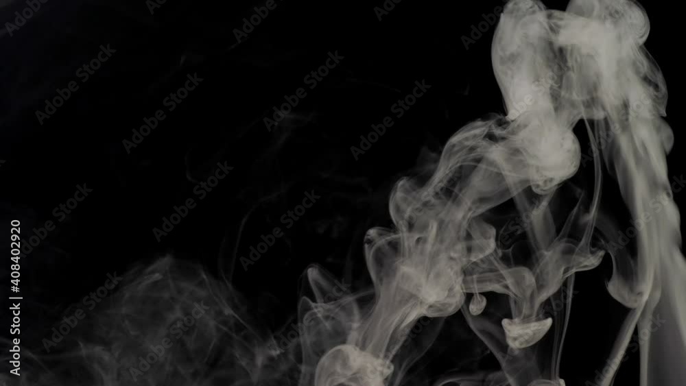 White smoke on a black background. Slow-motion. Vape smoke. Vapor, fog ...