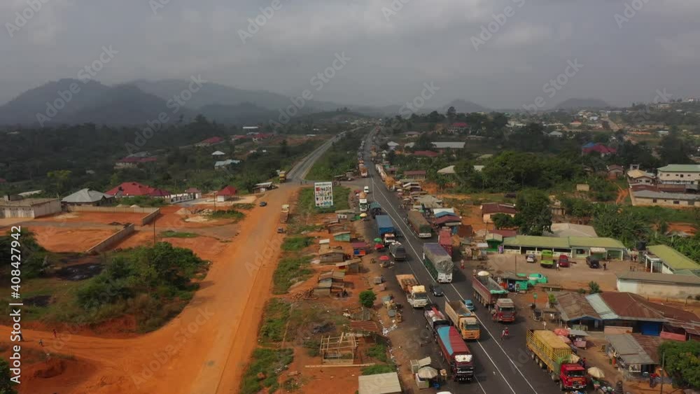 Aerial trucks parking rural village highway Ghana Africa part 2 4K. Old ...
