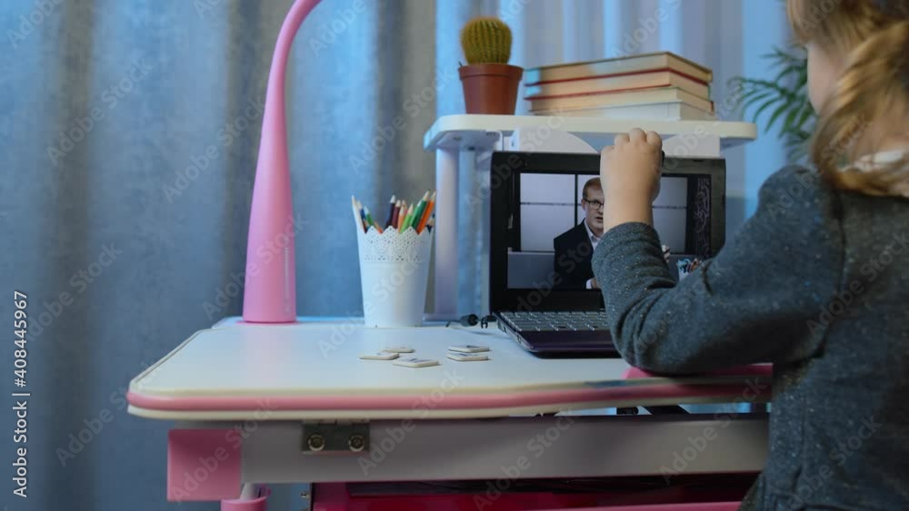 Vidéo Stock Preschool child girl distance online learning at home. Cute ...