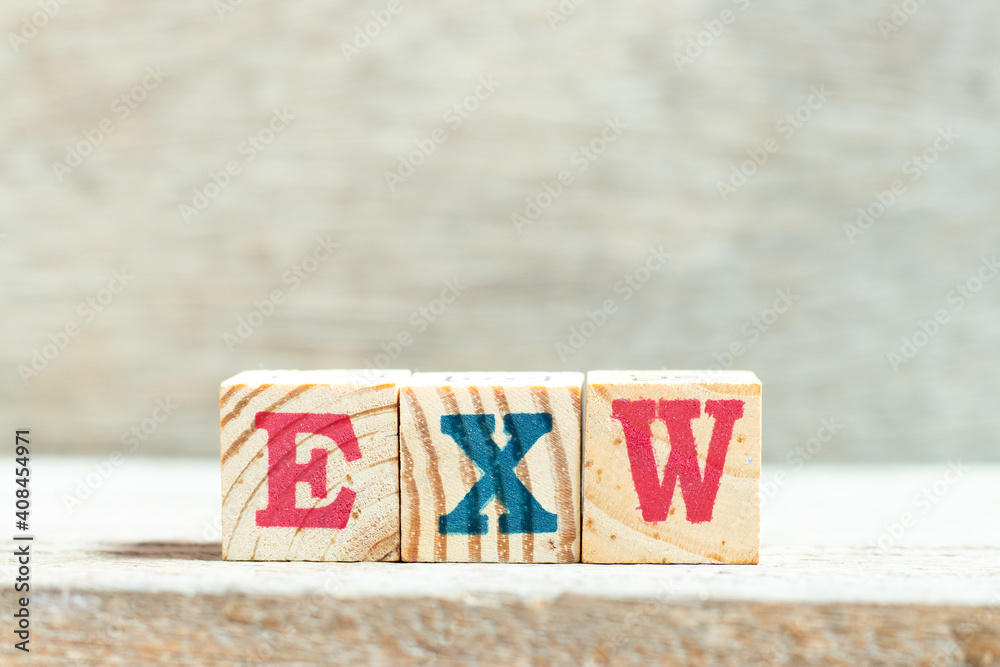 Alphabet letter block in word EXW (abbreviation of Ex works) on wood ...