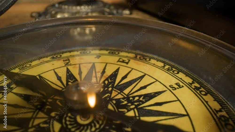 Closer look of the moving arrows of the compass on top of the ...